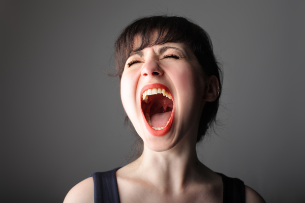 Woman With Wide Open Mouth And Tongue Out Free Stock Photo